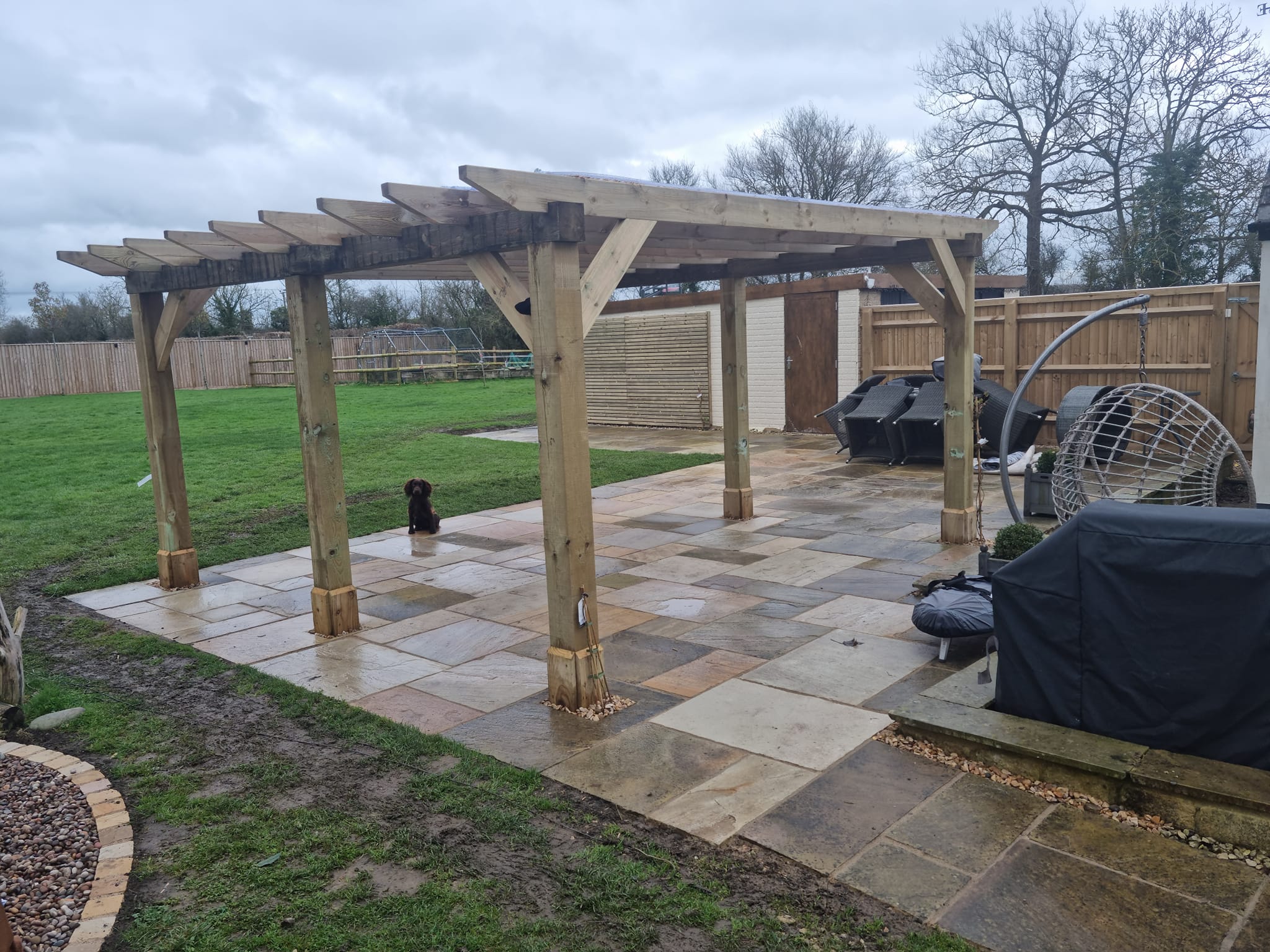 Patio area using both reclaimed and new sandstone pavers with a pergola ...